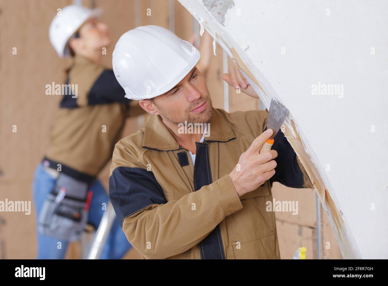 portrait of plasterers at work Stock Photo - Alamy