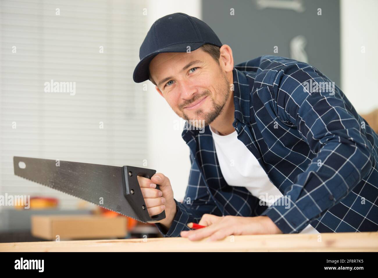 a man with carpentry tools Stock Photo - Alamy