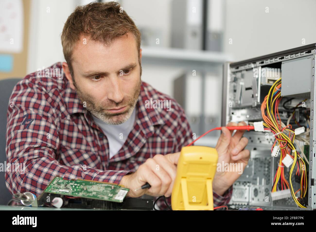 technician repairing a computer Stock Photo - Alamy