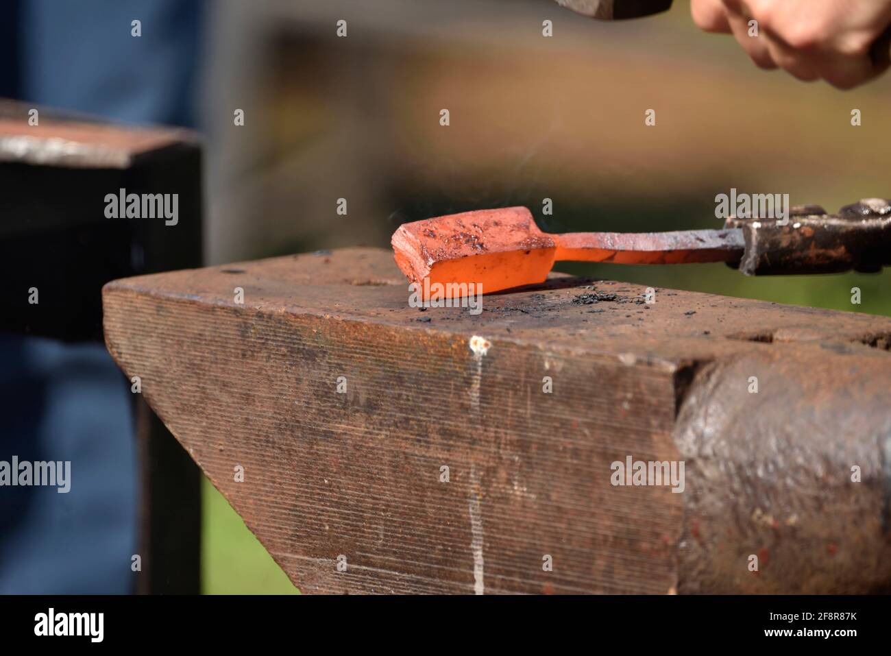 forging damascus steel by hand on the anvil Stock Photo - Alamy