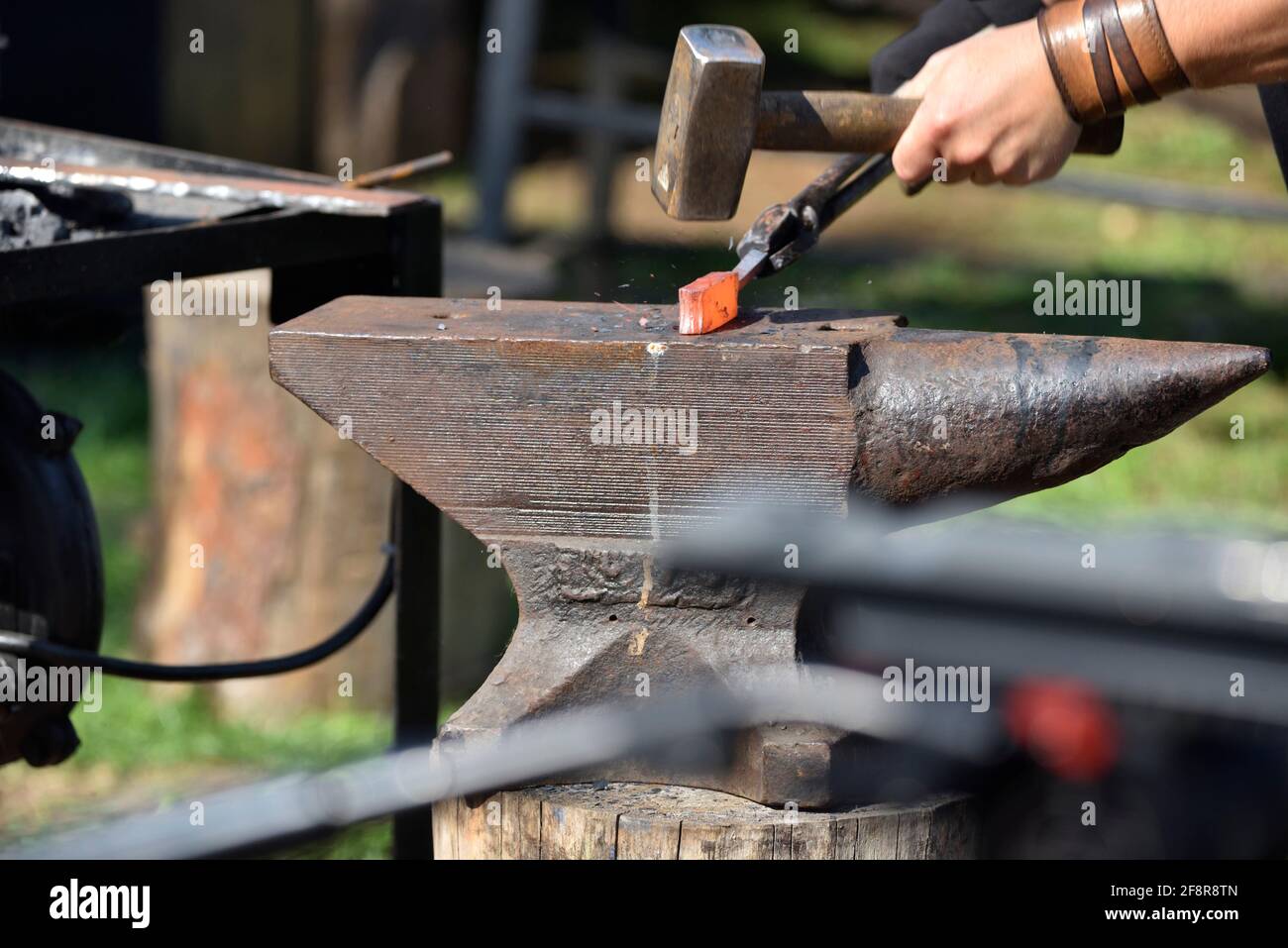 forging damascus steel by hand on the anvil Stock Photo - Alamy