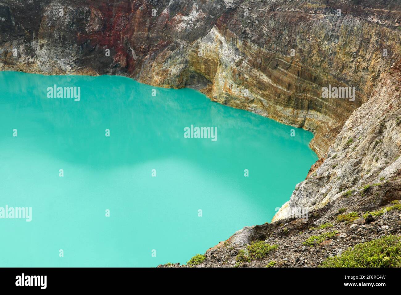 Adjacent green and red volcanic lakes of the famous tri-color - three ...
