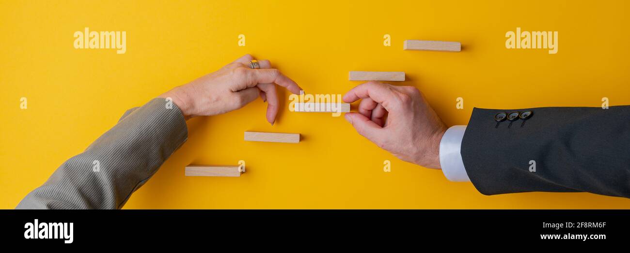 Hand of a businessman supporting a step in conceptual stairway for his ...