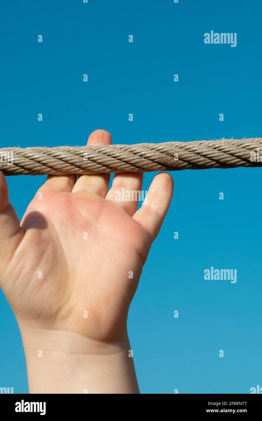 Child Hand Falling From a Rope Stock Photo - Alamy