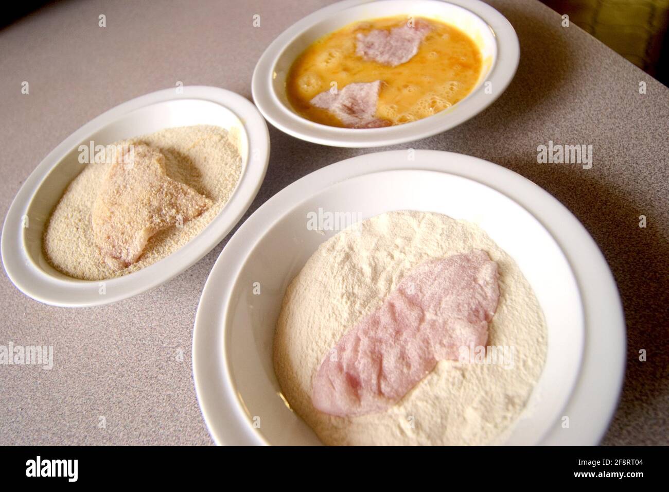 ingredients for breading a Wiener schnitzel Stock Photo - Alamy