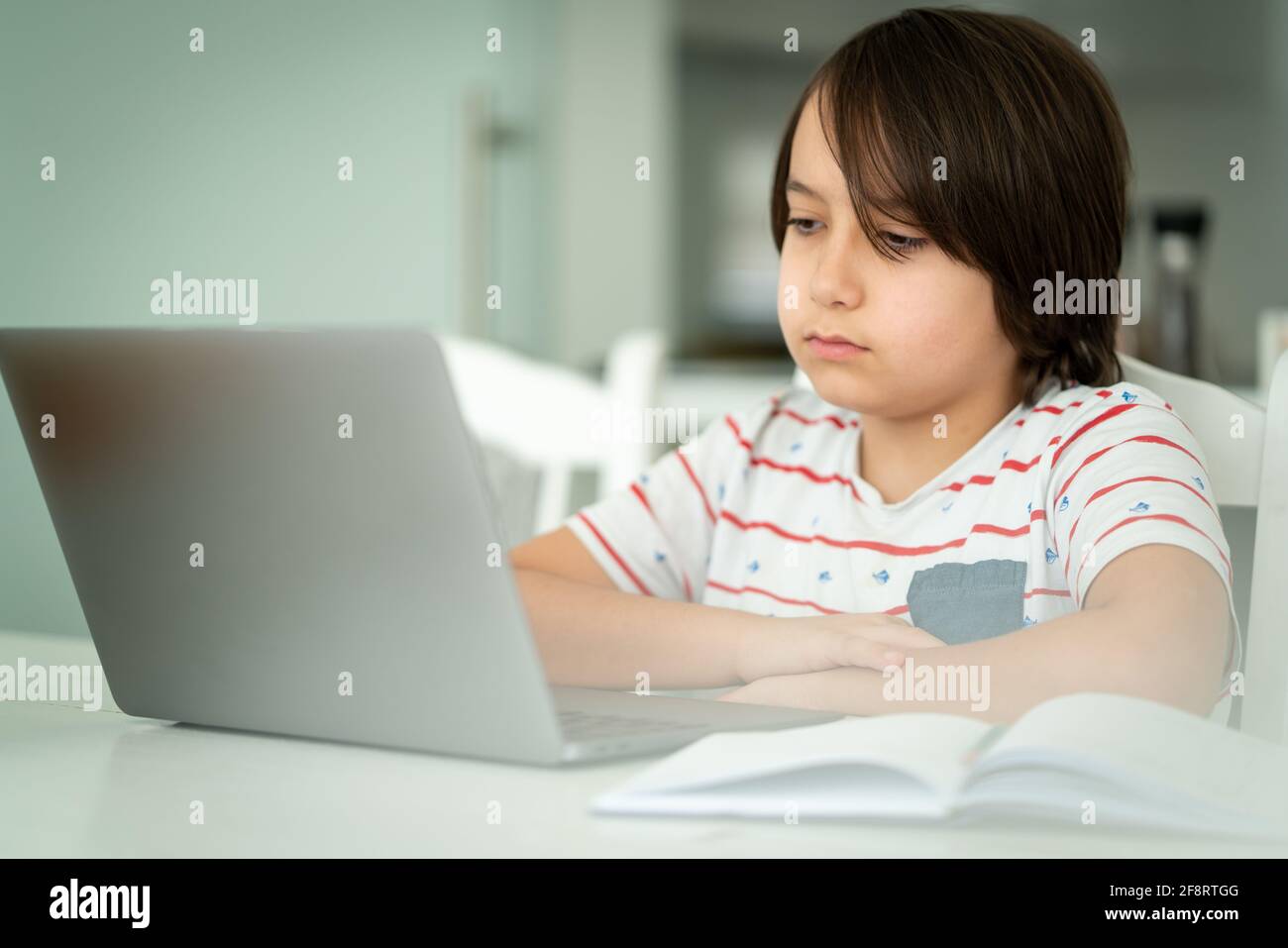 Child using laptop at home indoors. high quality photo Stock Photo - Alamy