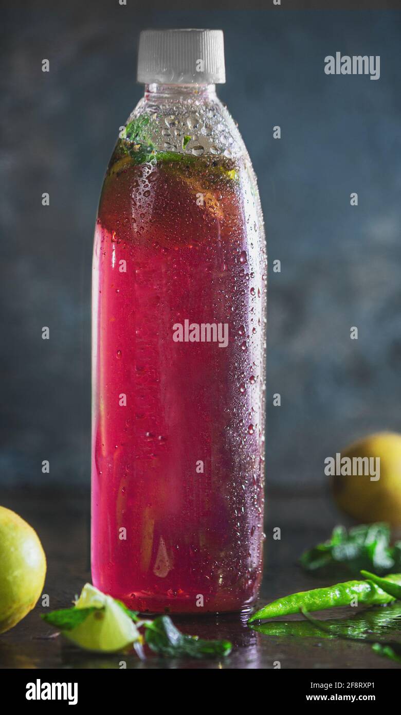 Red mocktail served in bottle Stock Photo - Alamy