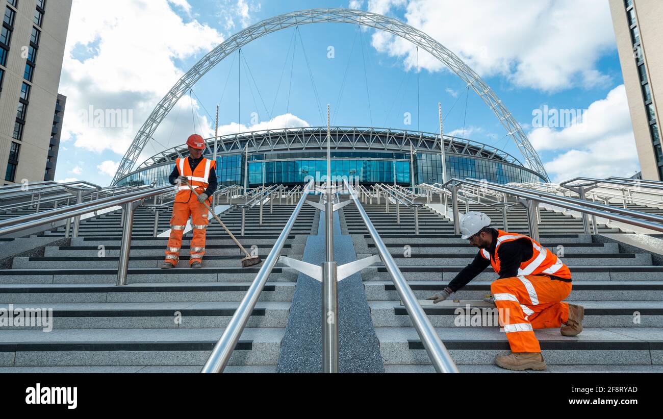 London, UK. 15 April 2021. Construction workers on the soon to be ...