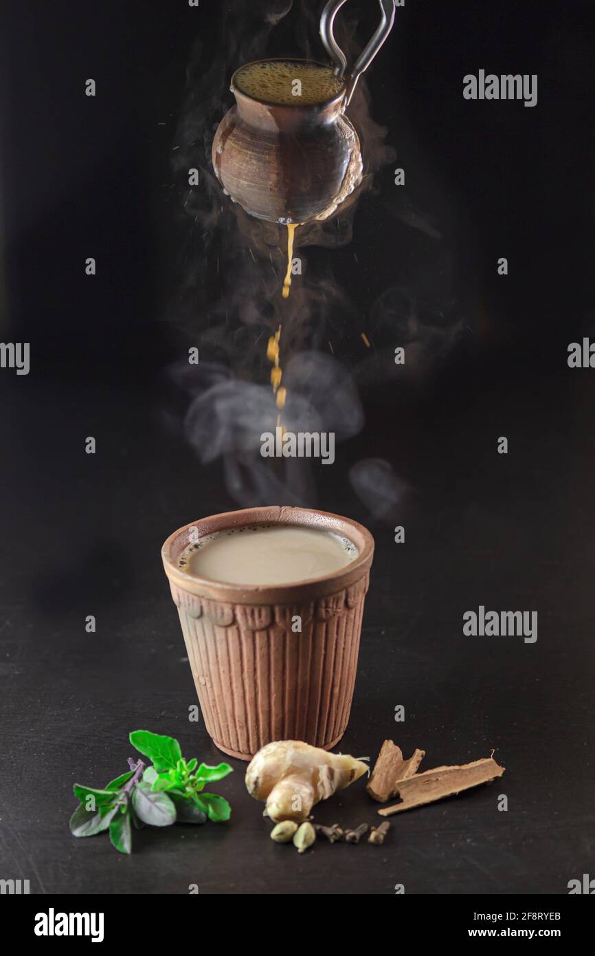 Hot Tea pouring from kulhad(earthen pot/mud pot Stock Photo - Alamy