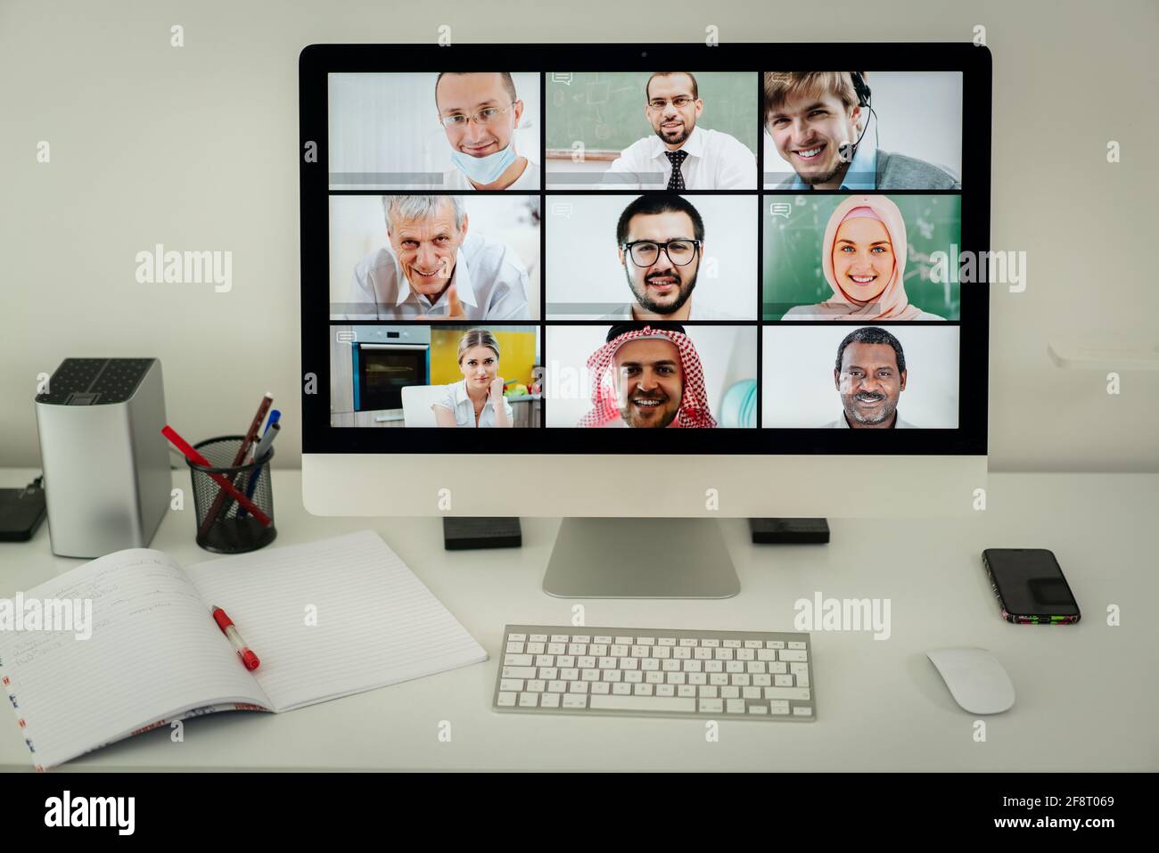 Online business conference screen in hands new normal Stock Photo - Alamy