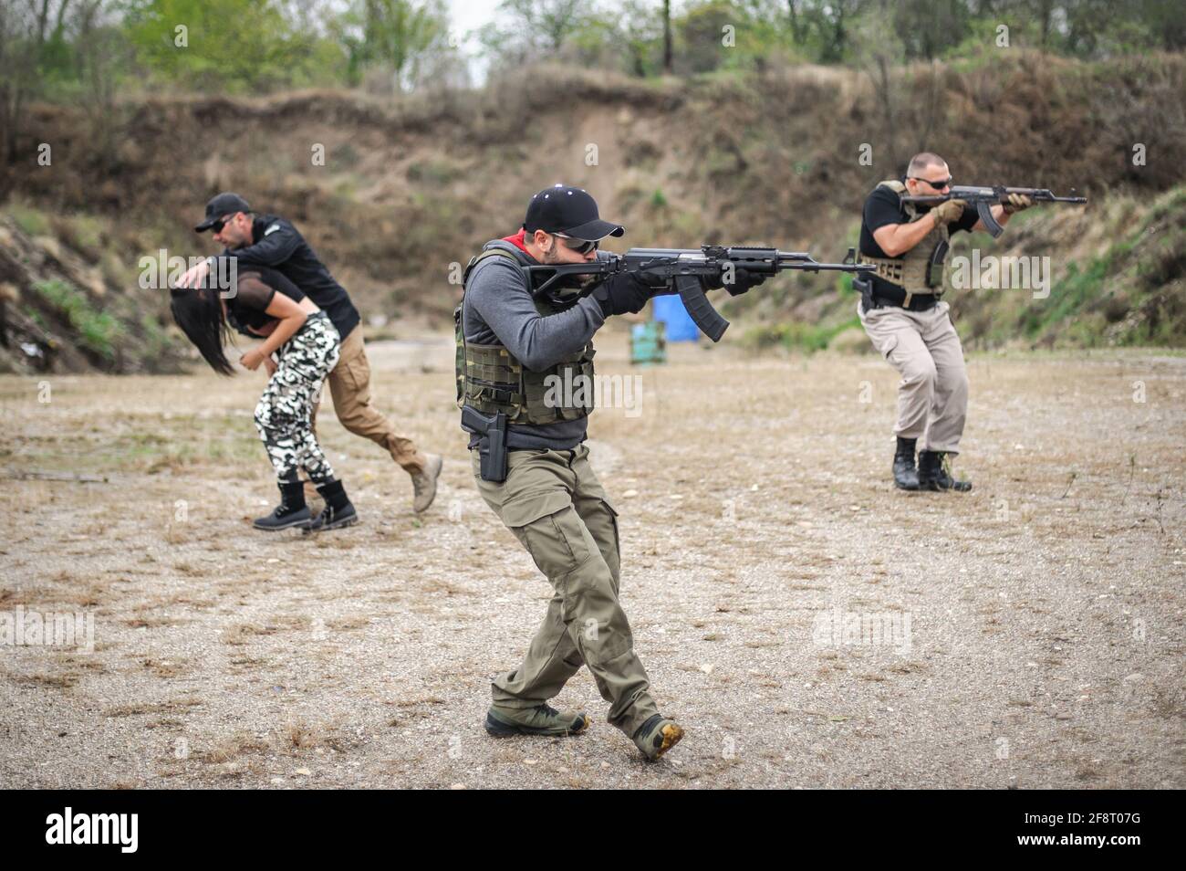 Bodyguard and VIP people security protection. Combat gun shooting ...