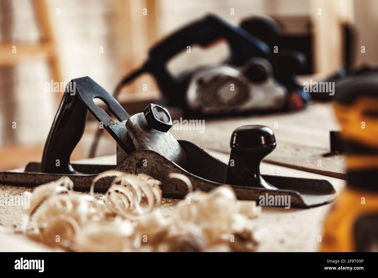 Carpentry plane tool for woodworking in workshop Stock Photo - Alamy