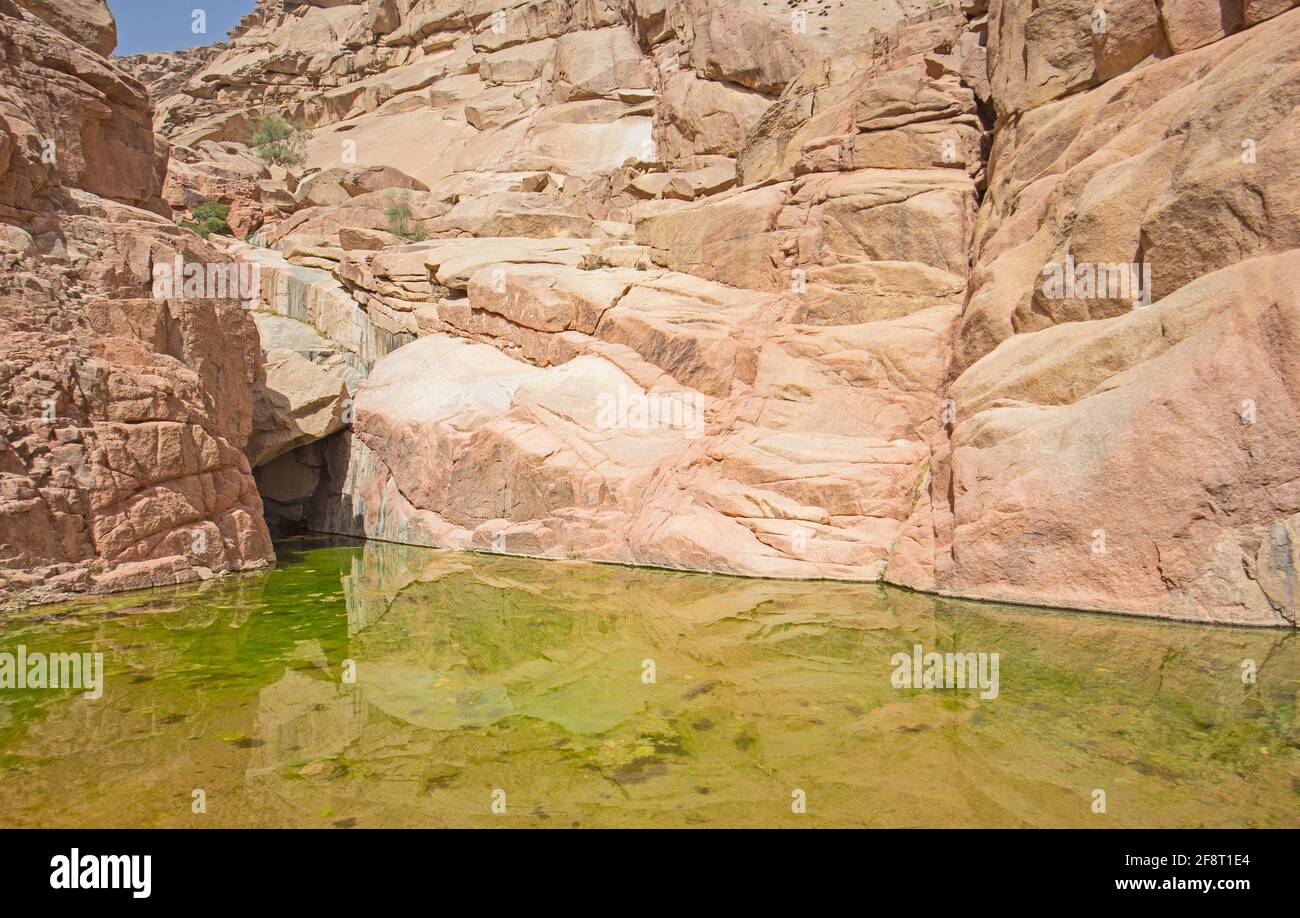 Freshwater pool under overhang in desert mountain canyon Stock Photo ...