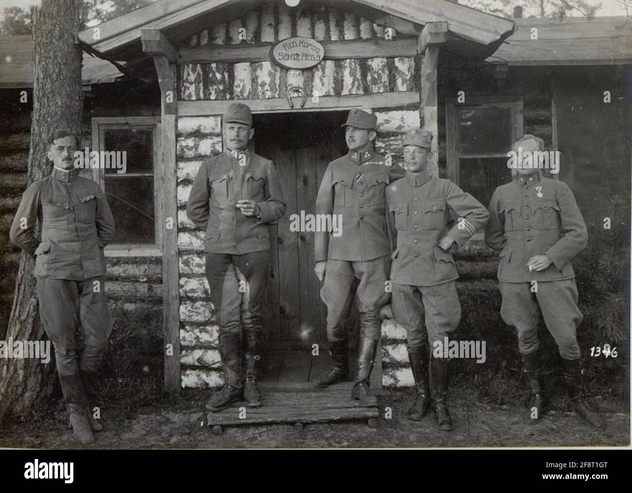 Officers and soldiers posing in front of a soldier home in the section ...