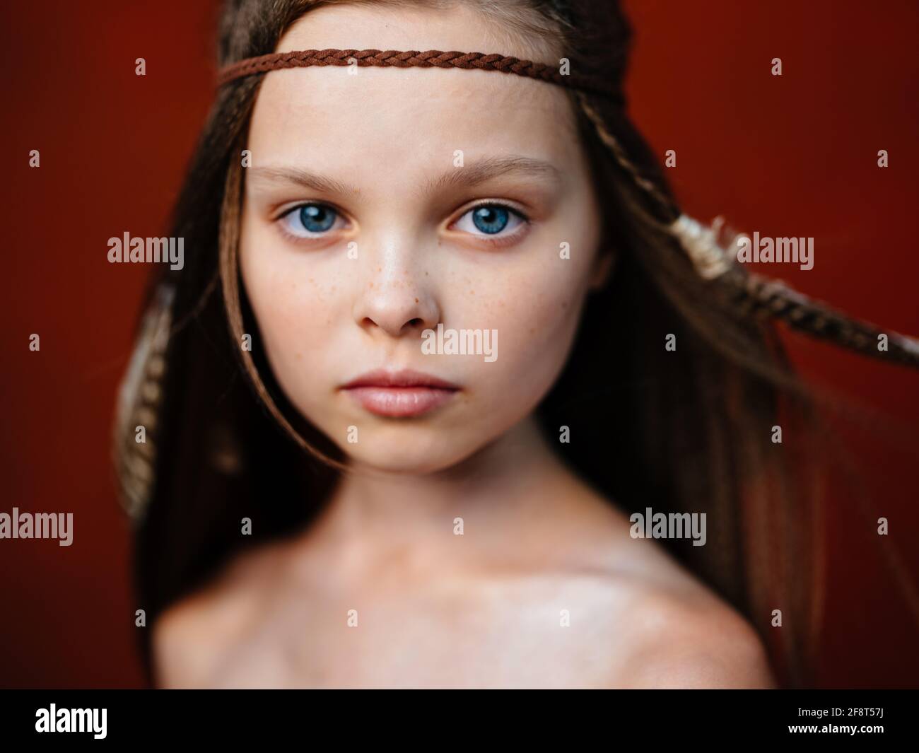 Happy girl with a feather in her hair aborigines indian tribe Shaman ...
