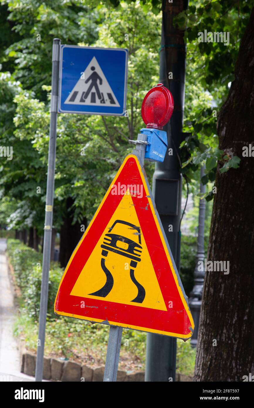 Slippery When Wet and Pedestrian Crossing Signs in Florence, Italy ...