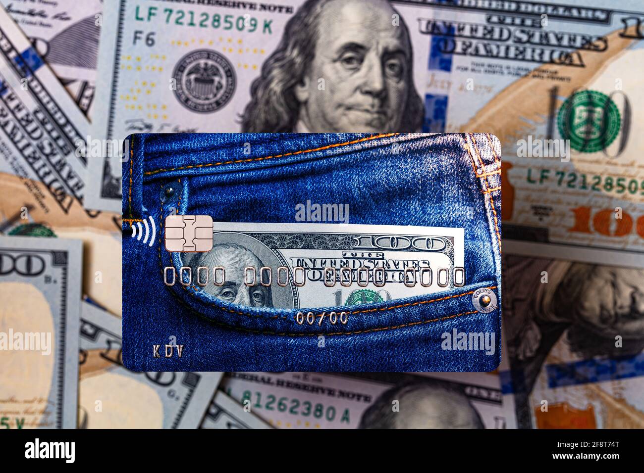 Debit card with dollars in pocket design on US 100 dollar banknotes ...