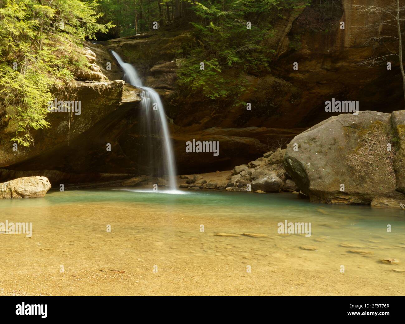 Breathtaking view of cascade along a hiking trail in Hocking Hills ...
