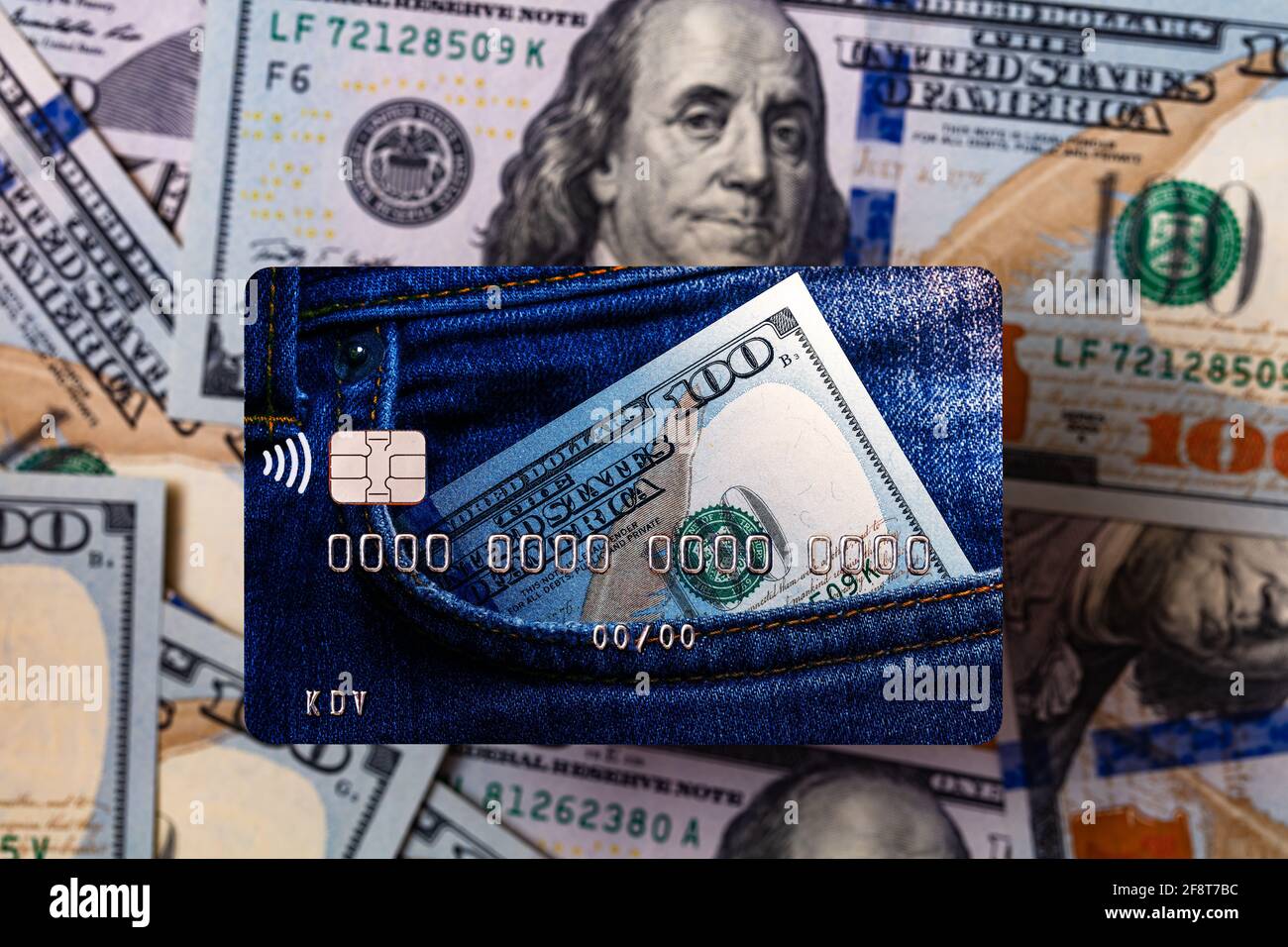 Debit card with dollars in pocket design on US 100 dollar banknotes ...