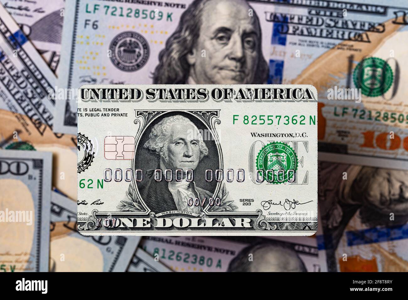 Debit card with 1 dollar design on US 100 dollar banknotes background ...