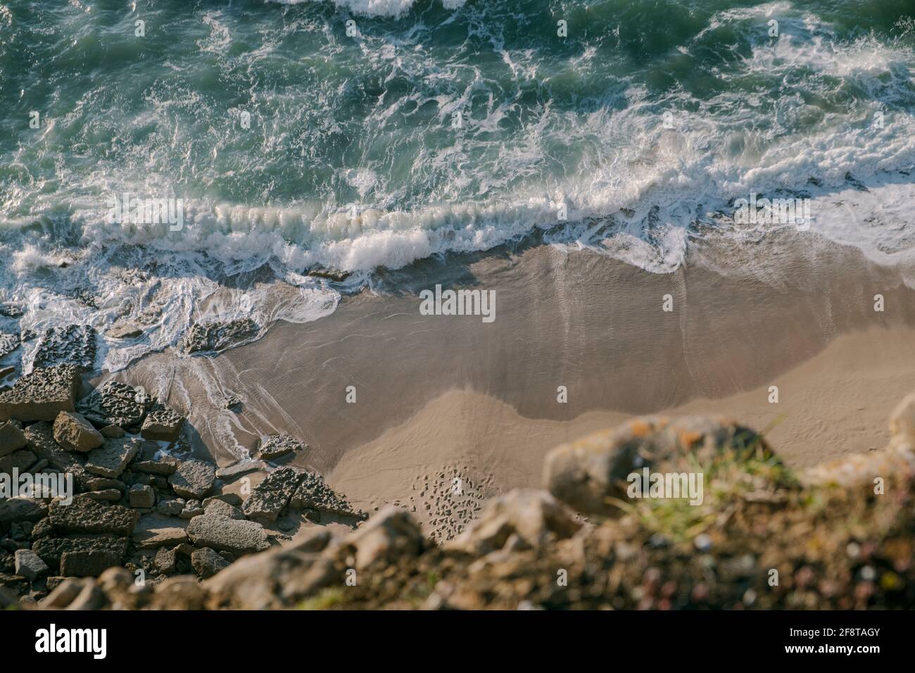 Aerial view of waves crashing into the beach Stock Photo - Alamy