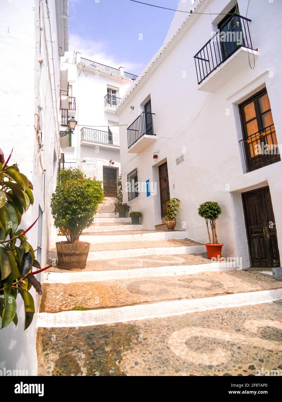 old town of granada in spain with traditional houses and orange trees ...