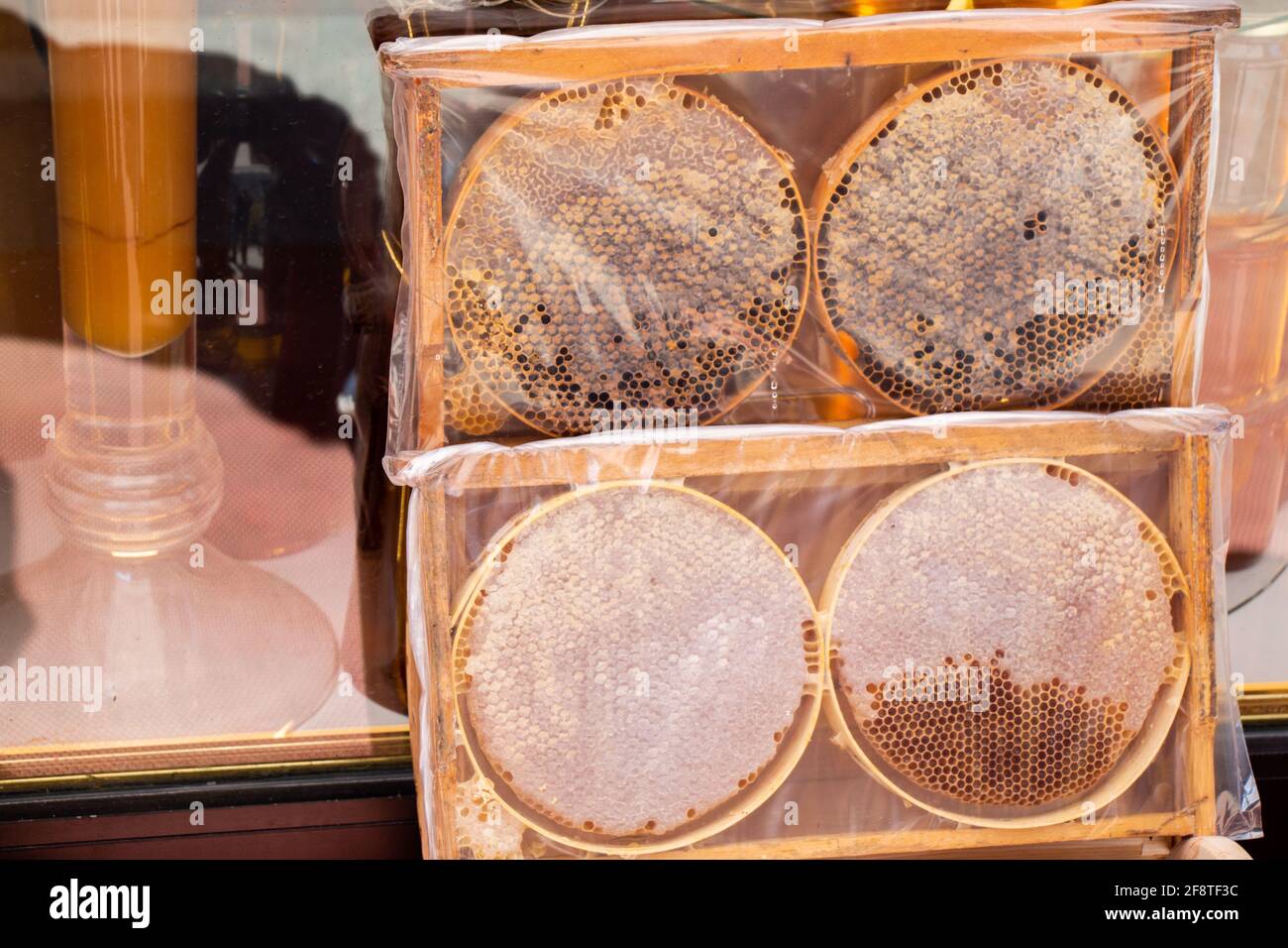 Honey in honeycomb from round beehive with sweet honey Stock Photo - Alamy