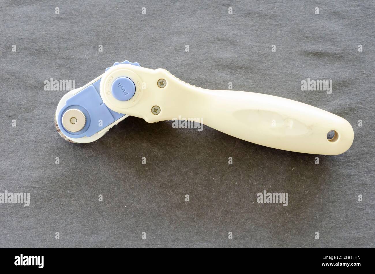 Rotary Paper Cutter At An Angle Stock Photo - Alamy