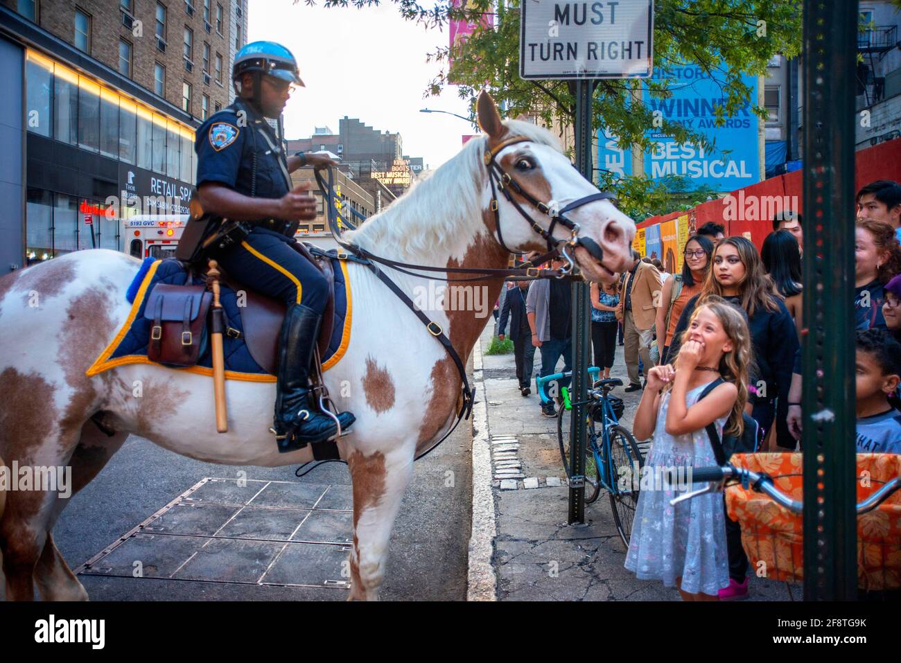 Tourists and Police officer in front of the The Imperial Theater Facade ...