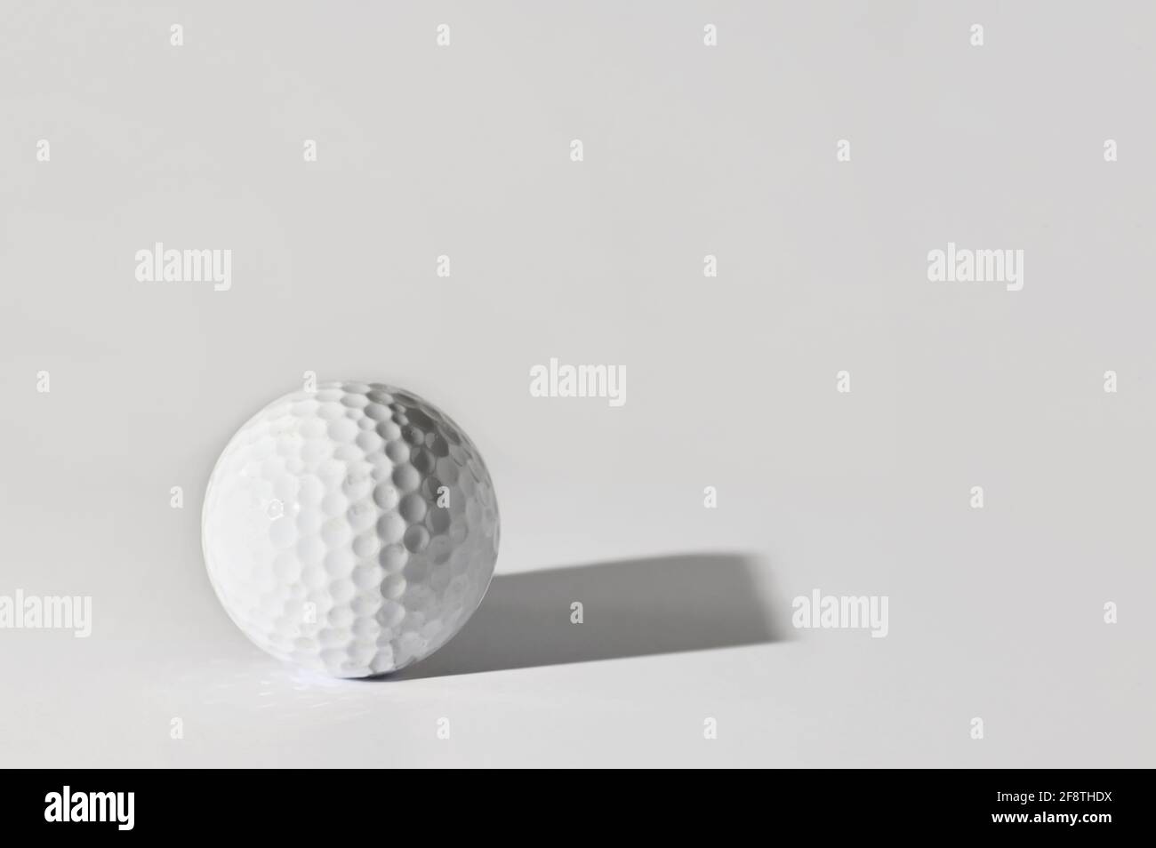 Abstract Golf Ball with Square Shadow on White Table Stock Photo - Alamy