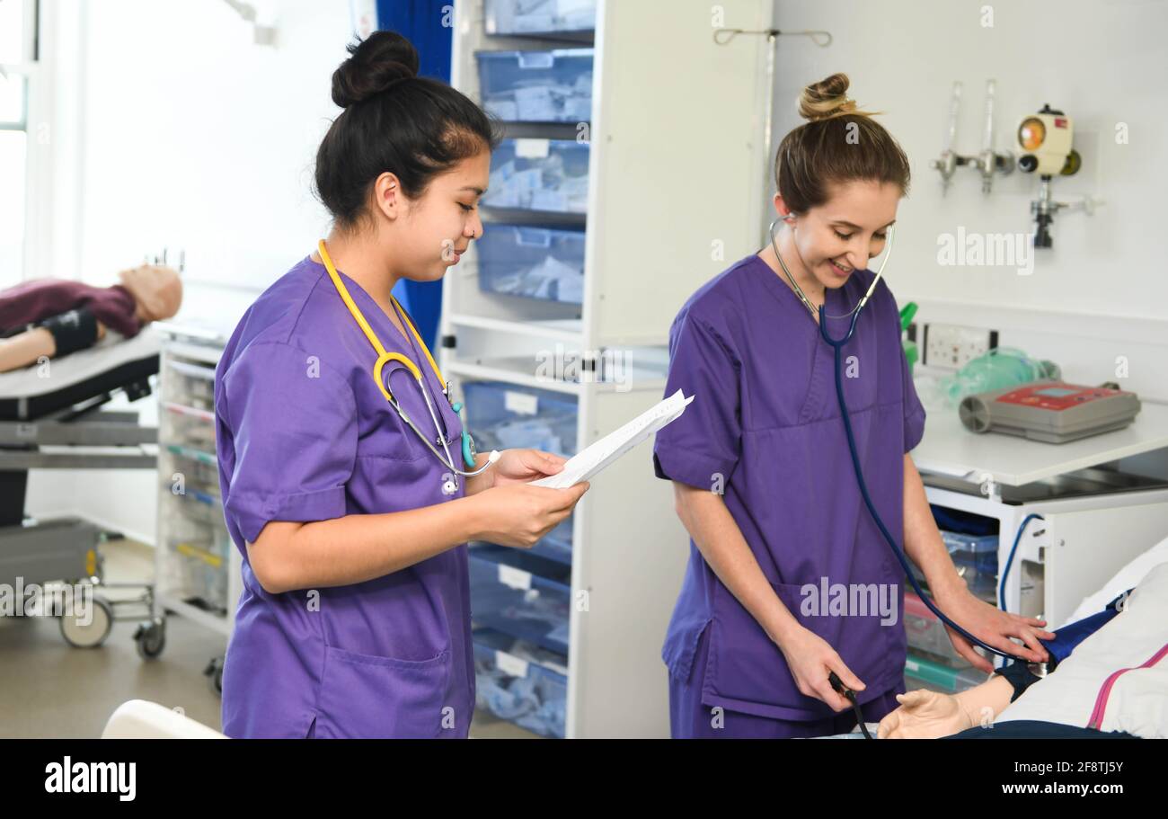 Two female trainee nurses are pictured on a practice ward at a NHS ...