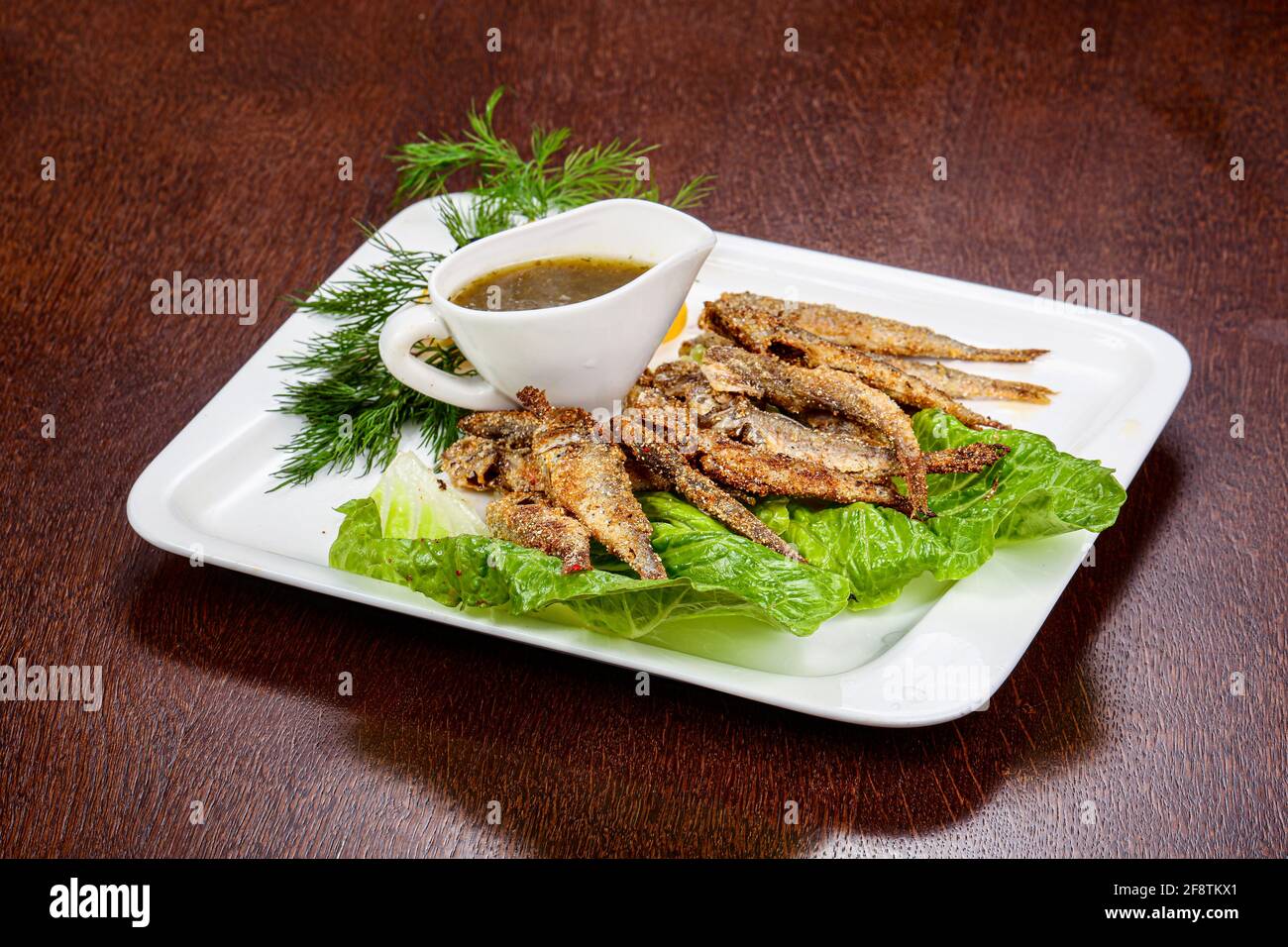 Fried barabulka fish snack with sauce Stock Photo - Alamy