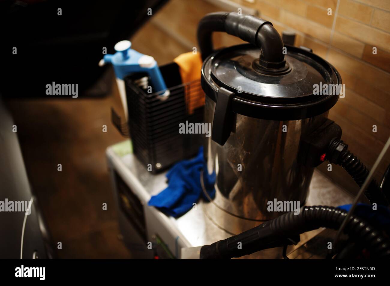 Steam vacuum cleaner and car cleaning chemicals Stock Photo - Alamy