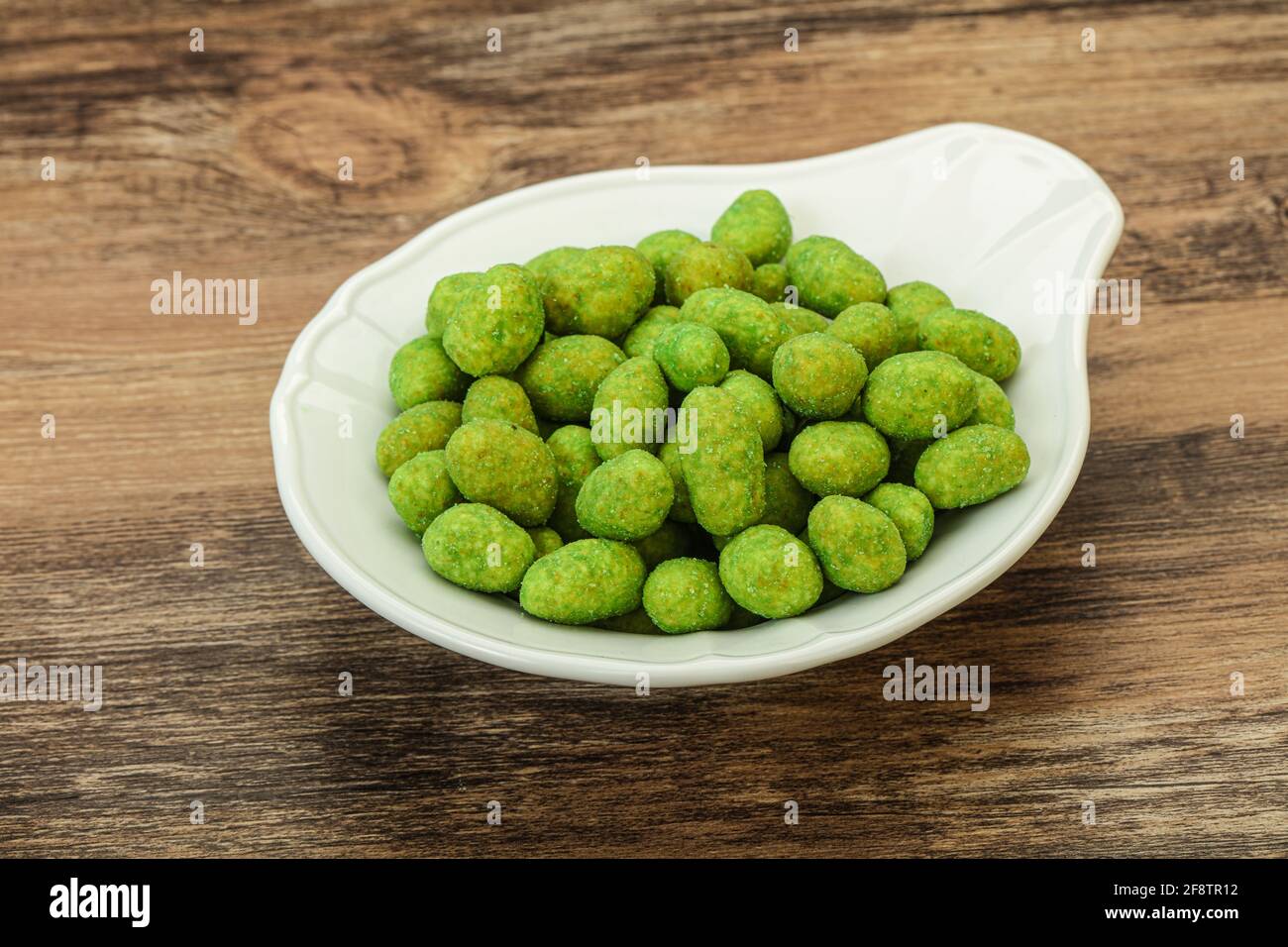 Spicy wasabi peanuts snack in the bowl Stock Photo - Alamy