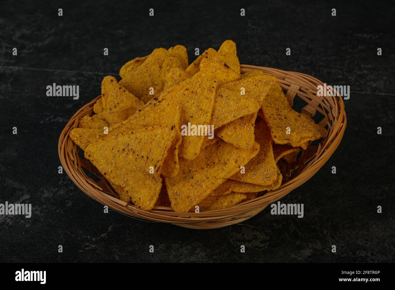Mexican crunchy corn nachos triangle heap Stock Photo - Alamy
