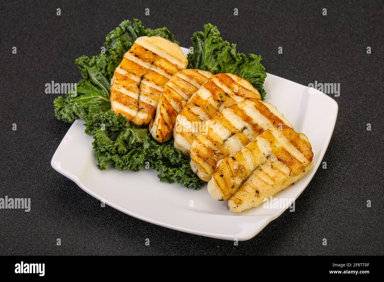 Grilled Greek haloumi cheese with herbs and spices Stock Photo - Alamy