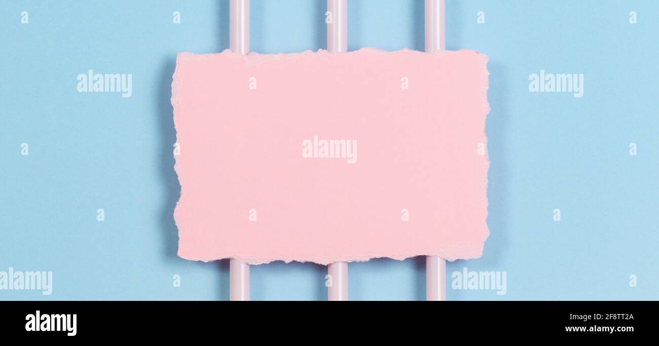 Blank light pink ripped piece of paper, torn paper card on light blue ...