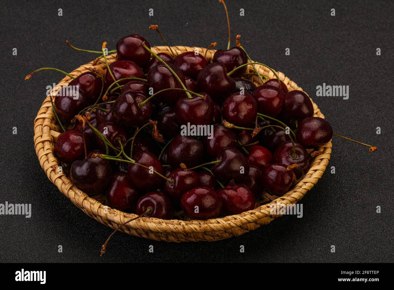Sweet ripe bird cherry in the basket Stock Photo - Alamy