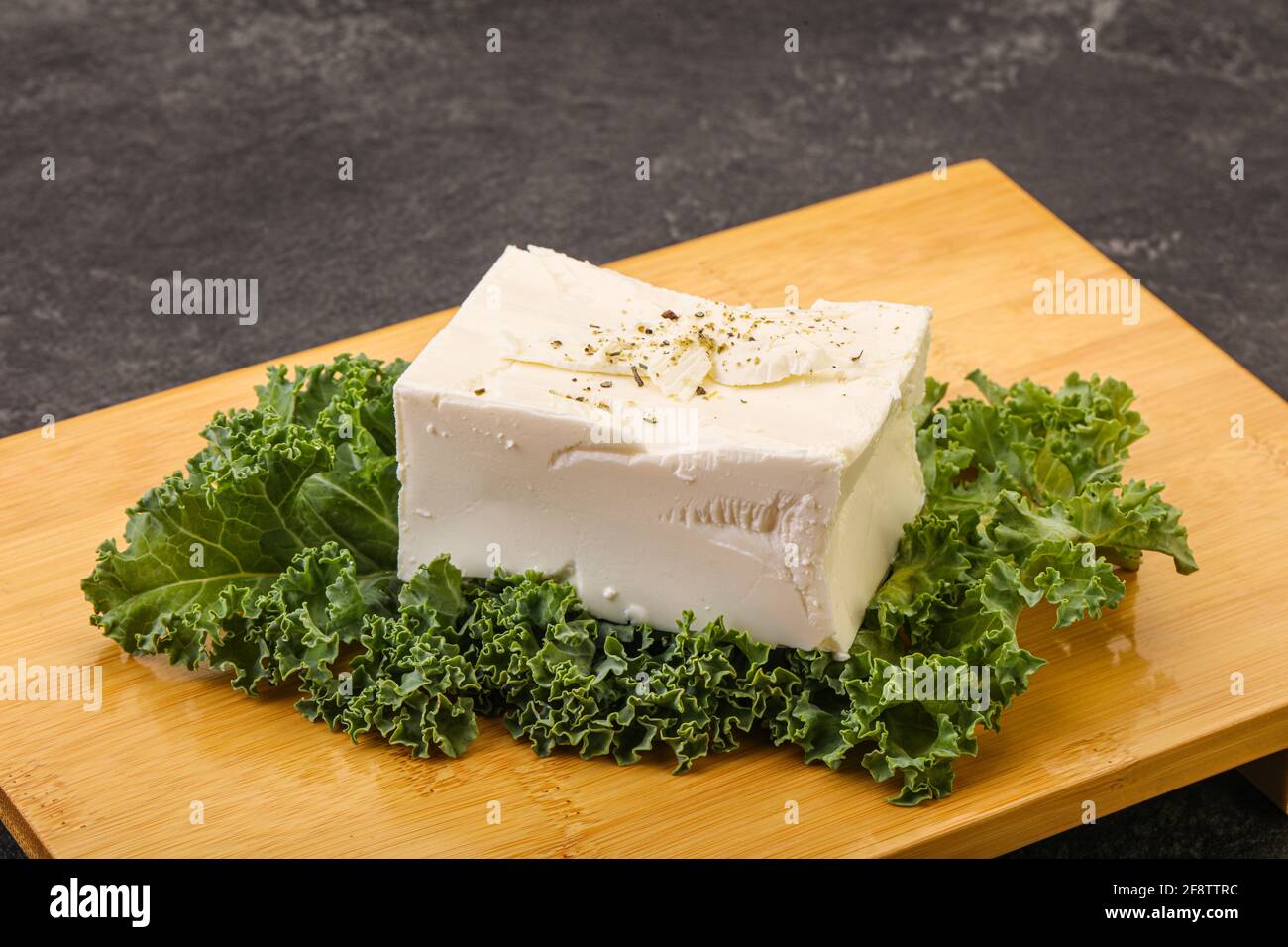 Traditional tasty Greek Feta soft cheese brick Stock Photo - Alamy