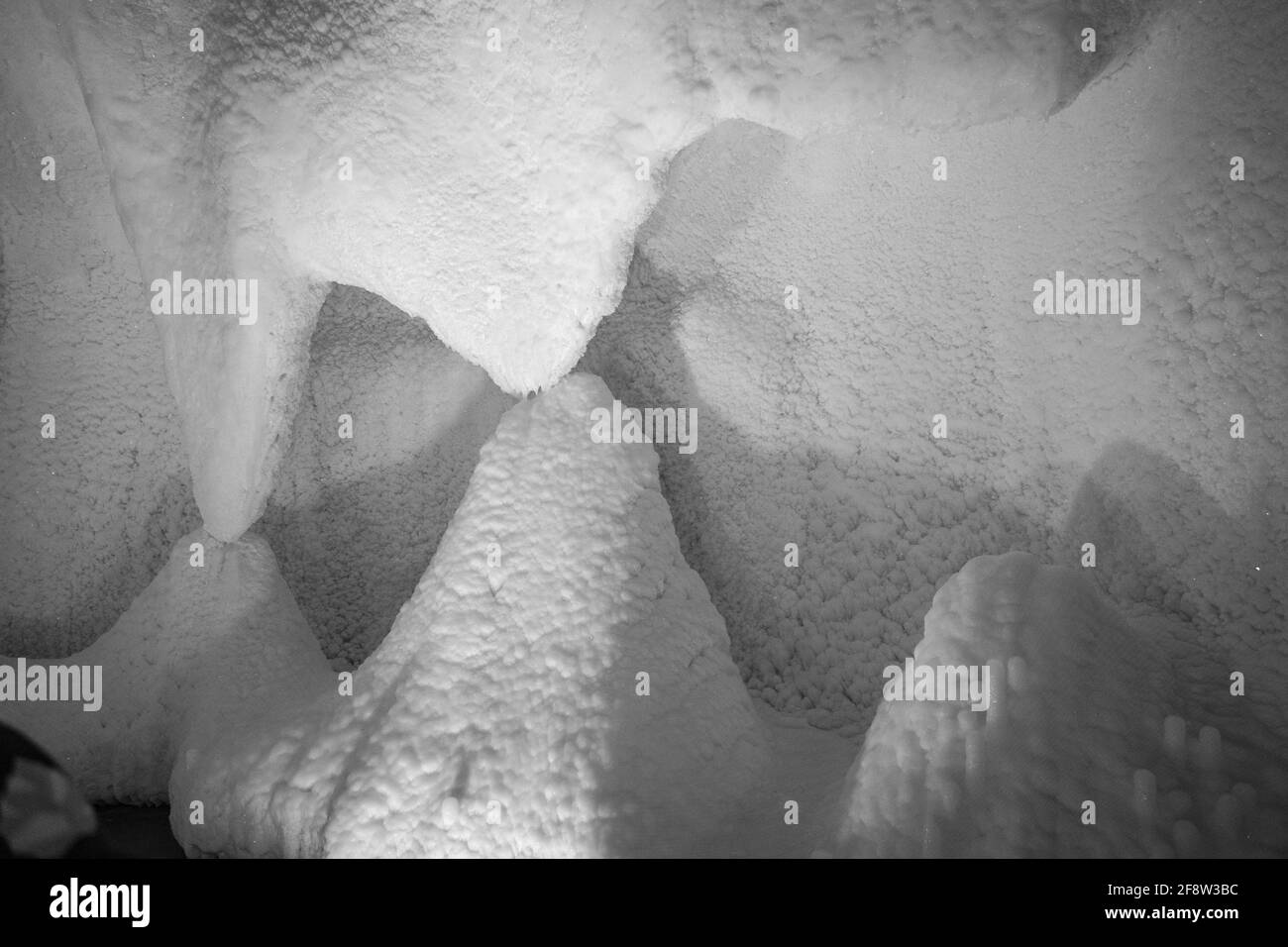 A fabulous artificial ice cave, the walls are covered with snow and ...