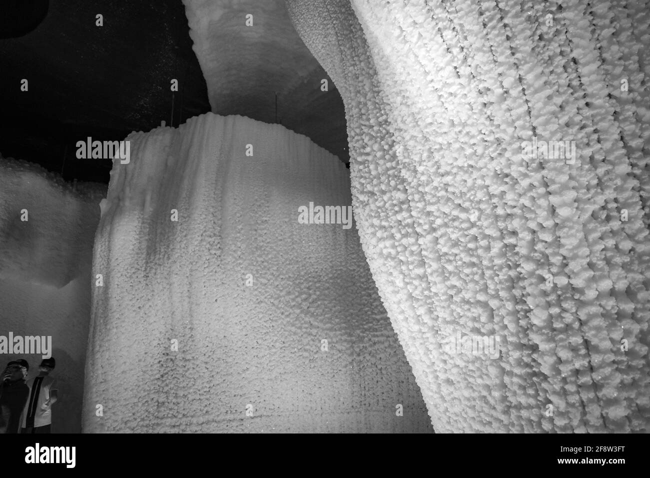 A fabulous artificial ice cave, the walls are covered with snow and ...