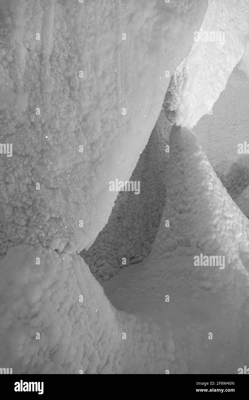 A fabulous artificial ice cave, the walls are covered with snow and ...