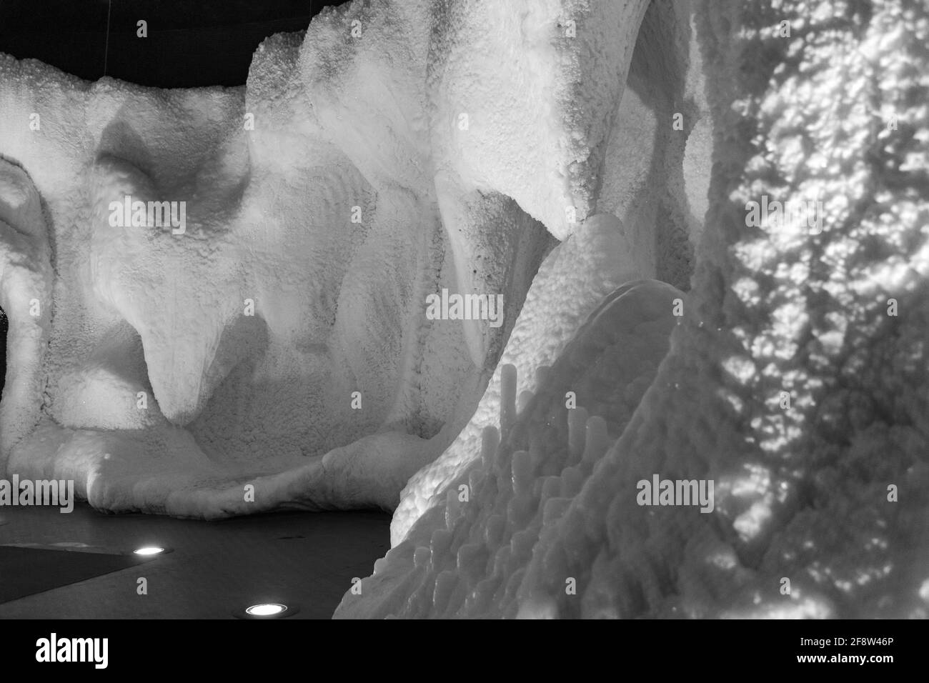 A fabulous artificial ice cave, the walls are covered with snow and ...