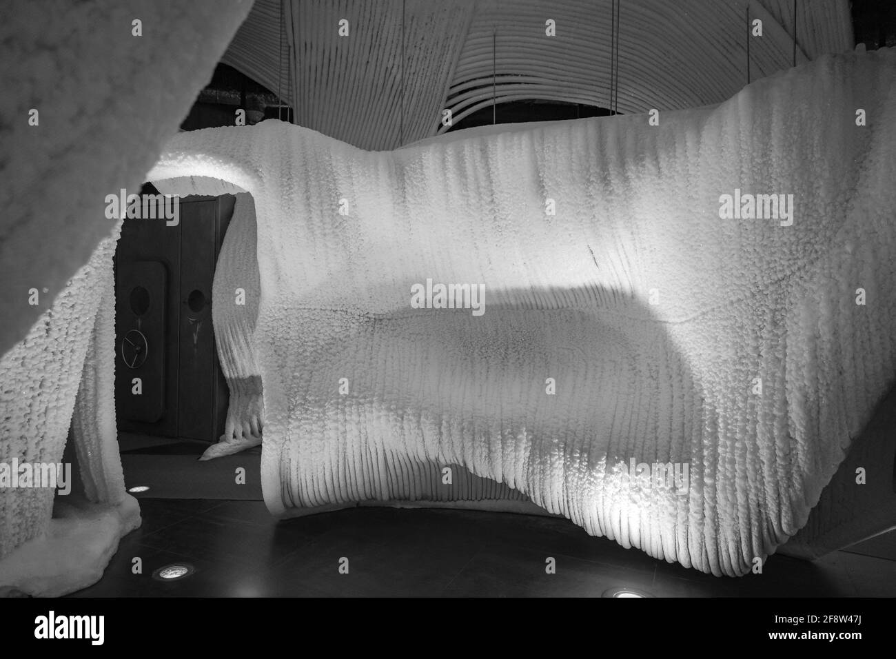 A fabulous artificial ice cave, the walls are covered with snow and ...