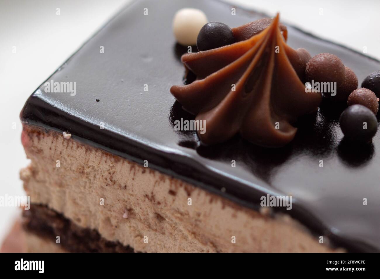 The cake is decoratively decorated. Chocolate cream French pastry. Part ...