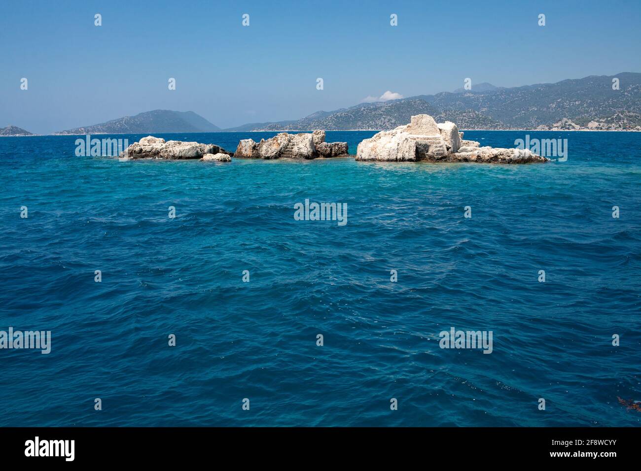 Rocks in the sea near the coast of Turkey. remains of ancient buildings ...