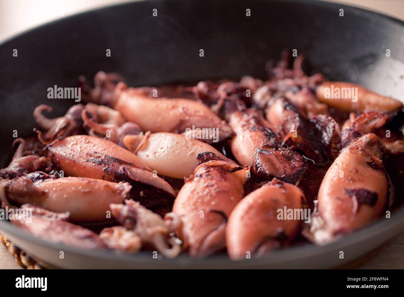 Cooking squid hi-res stock photography and images - Alamy