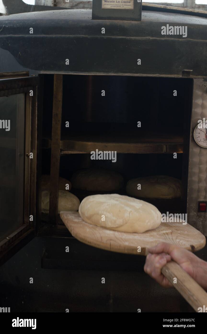 Open oven with a bread dough on the front Stock Photo - Alamy