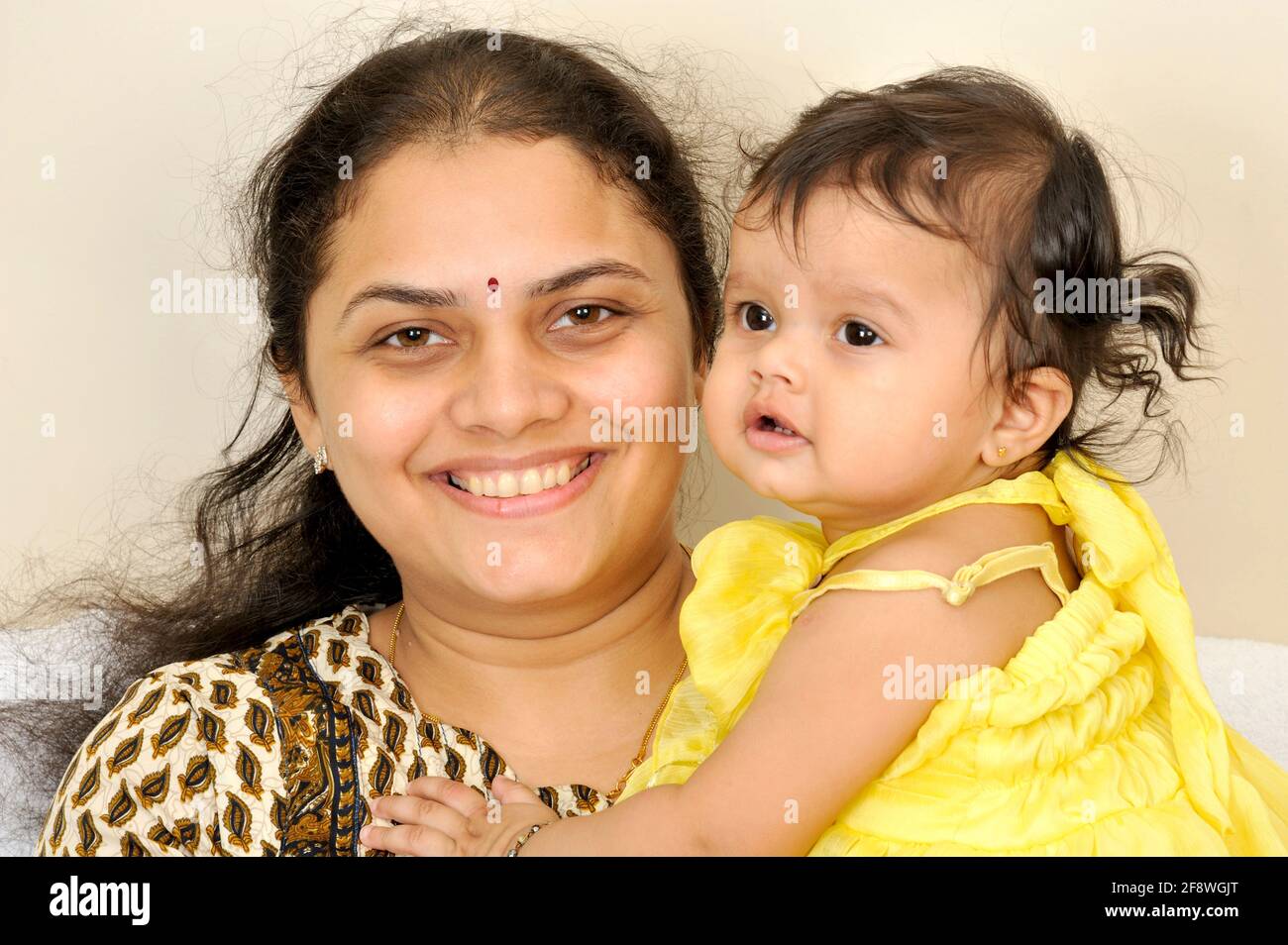 Portrait of happy mother and daughter spend time at home together ...