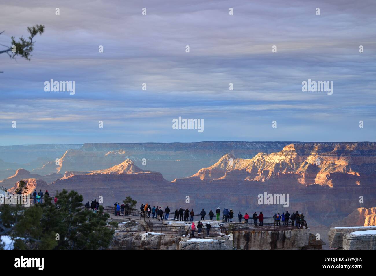 Visitors at the Grand Canyon overlook enjoying the magnificent view ...